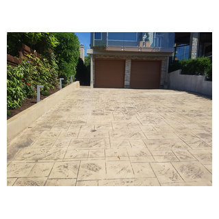 West Vancouver Stamp driveway with built in retainer - Transitional ...