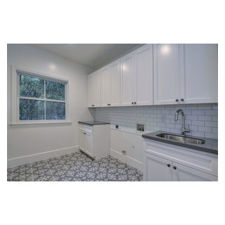 Spanish contemporary - laundry room with geometric tile floor ...