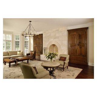 Floor to Ceiling Limestone Fireplace Flanked by Knotty Cherry Armoires ...