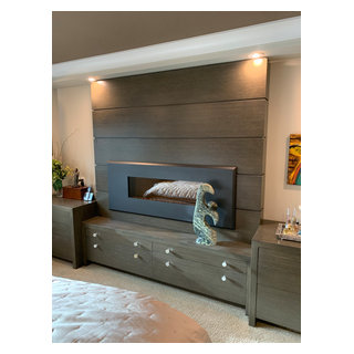 Master bedroom fireplace with custom millwork wall and built-ins ...