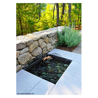 Bluestone patio dragonfly bubbler inset water feature with river stones ...