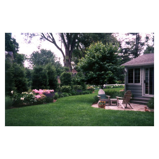 Evergreen trees hide a newly constructed house - Traditional - Patio ...