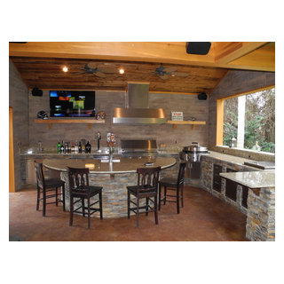 Outdoor kitchen with Solaire Grill, Evo Cooktop, kegerator and more ...