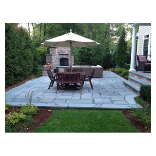 Raised Bluestone Patio with Fireplace and Landscaping - Traditional ...