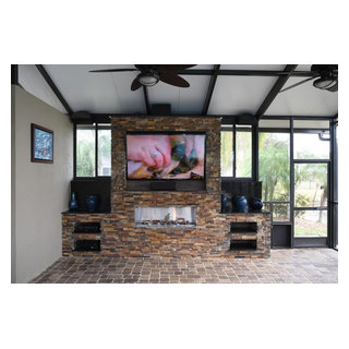Screened in pool area addition with TV and fireplace. - Contemporary ...