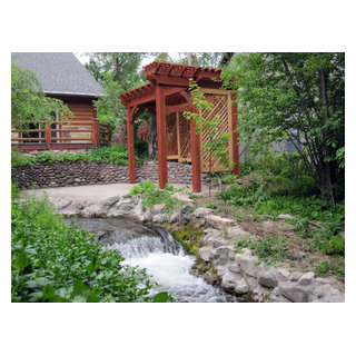 Timber Frame Arbor with Privacy Trellis next to Backyard Stream ...