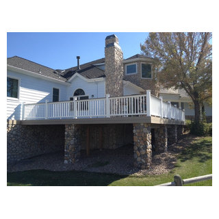 TimberTech deck with stone columns and custom railings - Traditional ...