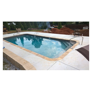 2' Radius pool with custom steps and bench and travertine coping ...