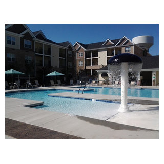 A pool with many features: beach entry, mushroom, basketball ...