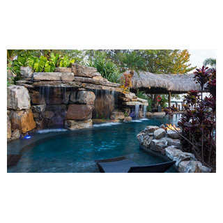 Custom Rock Waterfall Pool with Stone Grotto, Stream and Tiki Hut ...