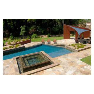 Dramatic angles and infinity overflow spa create a resort-like backyard ...