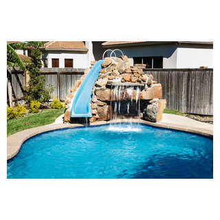 Freeform Pool with Slide and Grotto - Pool - Austin - by Eden Swimming ...