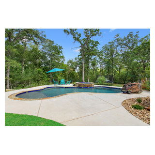 Freeform Pool with Spa, Rock Waterfall, Bubblers, and Flagstone Coping ...