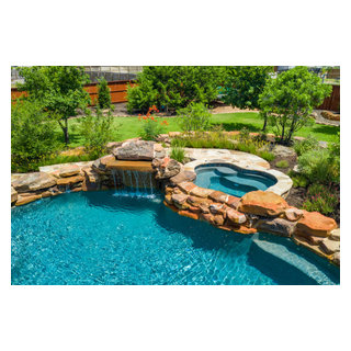 Freeform pool with weeping wall, grotto, and spa in San Antonio, Tx ...