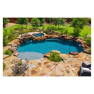 Freeform pool with weeping wall, grotto, and spa in San Antonio, Tx ...
