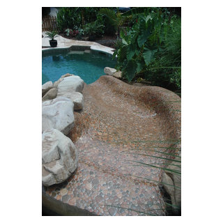 Hidden slide and tropical pool! - Tropical - Swimming Pool & Hot Tub ...