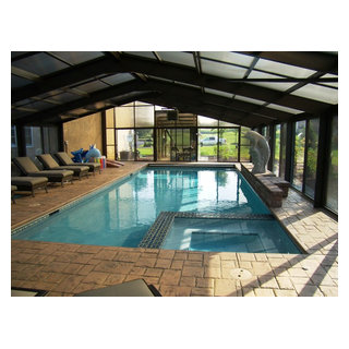 Indoor pool with raised wall and sheer descent waterfalls in Williams ...