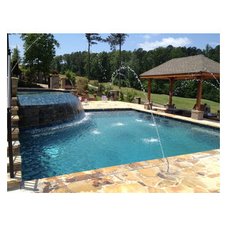 Infinity Edge with fountains, swim-up bar & sunken kitchen - Tropical ...