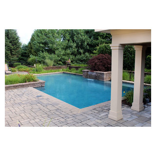 Lower Saucon custom pool with raised planters & sheer descent waterfall ...