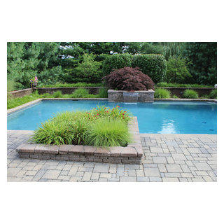 Lower Saucon custom pool with raised planters & sheer descent waterfall ...