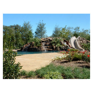 Natural Beach Entry Freeform Pool with slide, table and cascading ...