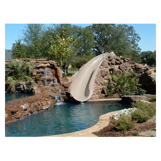 Natural Beach Entry Freeform Pool with slide, table and cascading ...