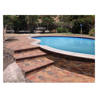 Pool with Copper Loose Stone Veneer and Pavers - Traditional - Swimming ...