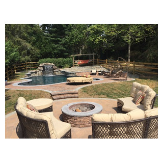 Freeform Pool with Grotto, fire pit, tanning ledge & floating table ...