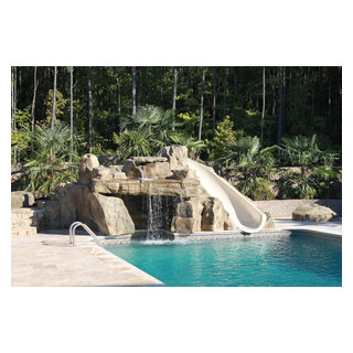 Rico Rock grotto, waterfall and slide into pool - Tropical - Pool ...