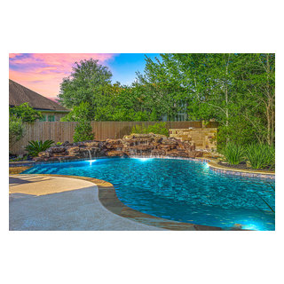 Rock Waterfall on Freeform Pool with Flagstone Coping - Tropical - Pool ...