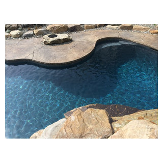 Spring Brook Township custom pool with boulders and waterfall ...