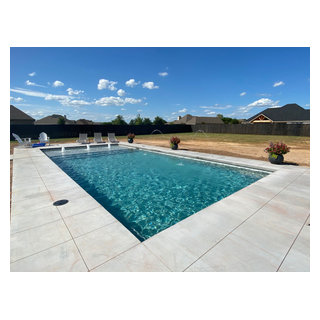 StoneScapes French Gray plaster, Massa Calacatta tile, and a scored ...