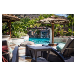 Tropical Beach Entry Pool & Spa with a Rock Slide & Grotto - Tropical ...