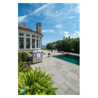 Unilock Natural Stone patio and pool with an ocean view - Beach Style ...