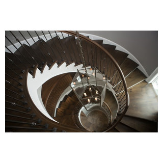 Custom Circular 3-Story Walnut Stair With Iron BalustersS - Costero ...