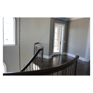 Custom Circular 3-Story Walnut Stair With Iron BalustersS - Bord de Mer ...