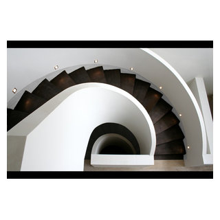 Geometric curved stair with curved dwarf wall balustrade - Modern ...