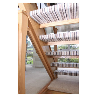 Open-tread oak staircase renovation with embedded glass balustrade ...