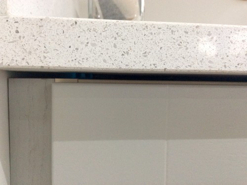 New Quartz countertops sitting on shims.