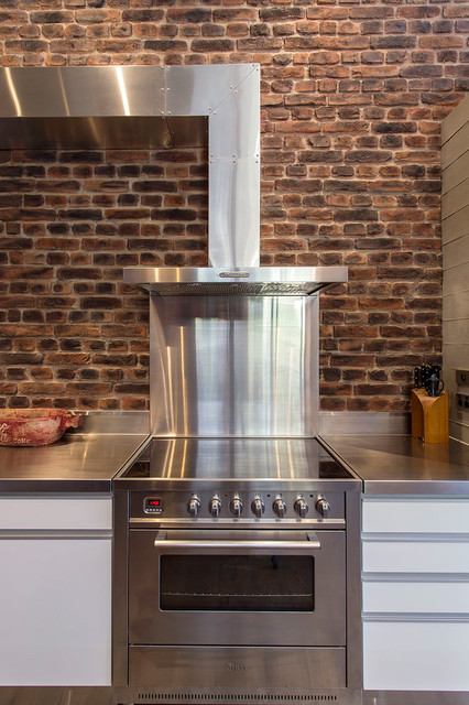Stainless steel cooker, range and flue with exposed brick - Industrial ...