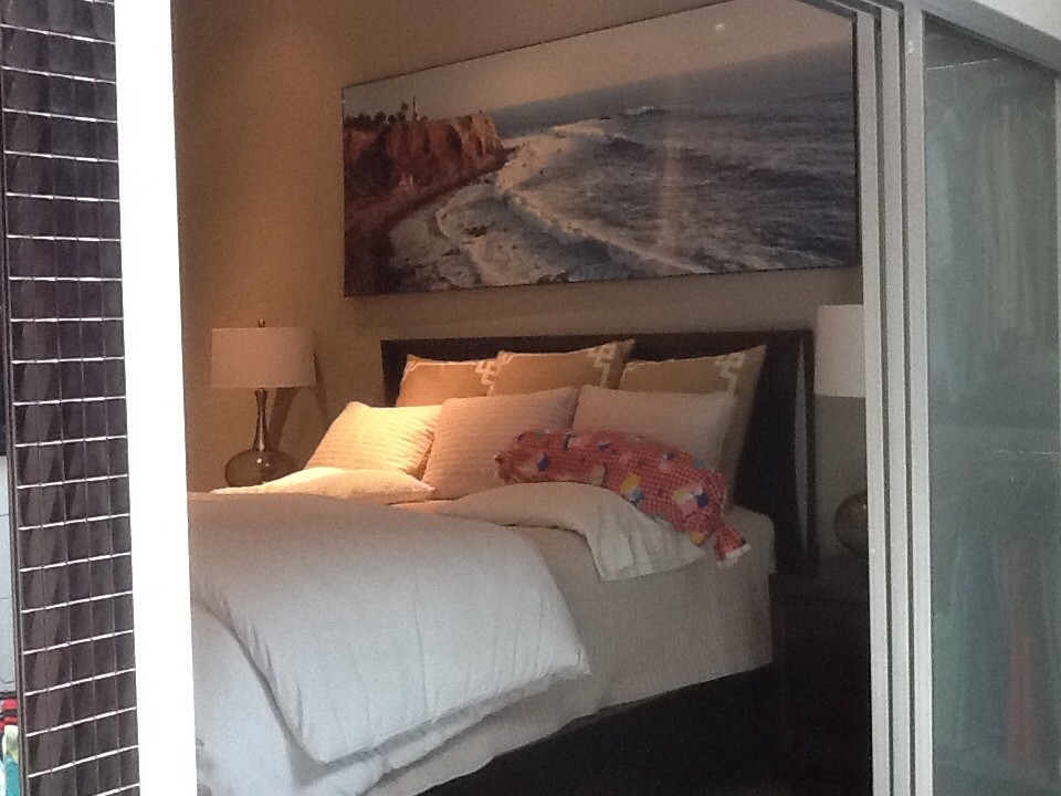 Any suggestion on how to dress this big boring bed.