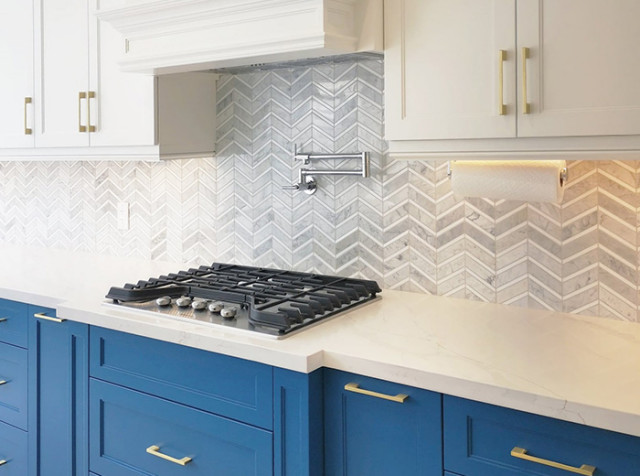 White shaker style upper cabinets contrasted with Zima Blue lower ...