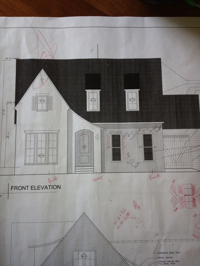 Above windows: Stucco band or beam in stucco