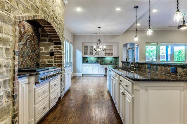 How to modernize a kitchen with stone arch over stove?