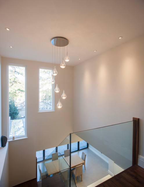 Small space enlarged - lowered basement /double height void entrance ...