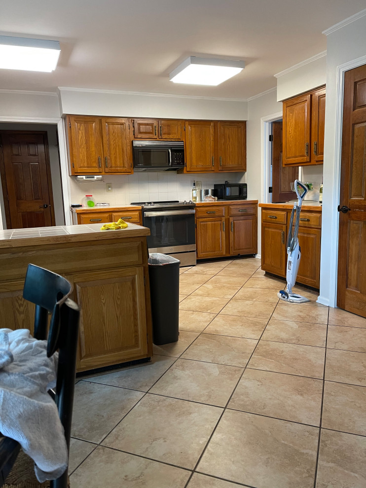 White kitchen cabinets with ugly tan tile floor?