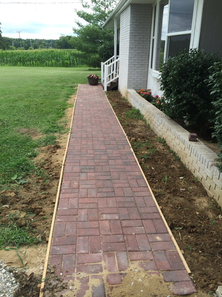 Ideas with landscaping for brick sidewalk that is parallel with house