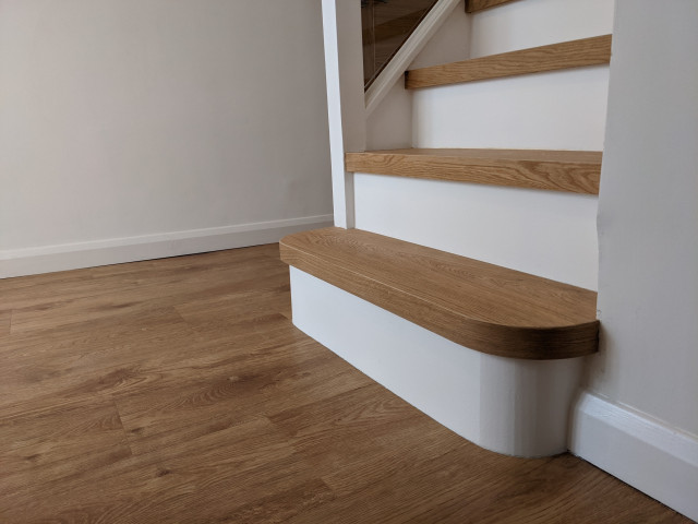 Engineered oak stair cladding with modern white painted risers, Epping ...