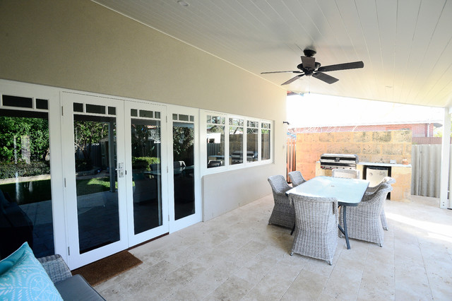 Alfresco area with timber lined ceiling and ceiling fan for hot summer ...