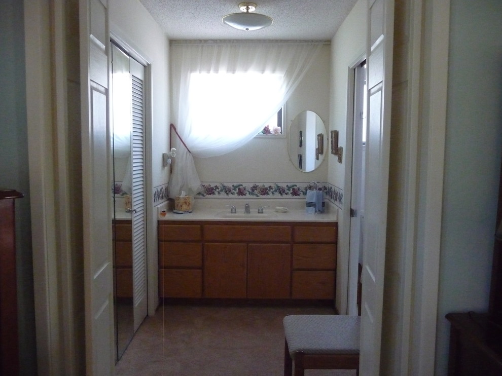 Off center window over the bathroom sink